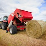 Tractor collecting haystack in the field — Stock Photo © rihardzz #6212366