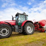 Tractor collecting haystack in the field — Stock Photo © rihardzz #6212366