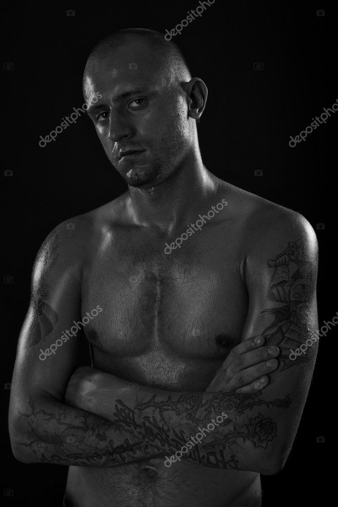 Young muscle bold male model in studio — Stock Photo © innervision #6524210