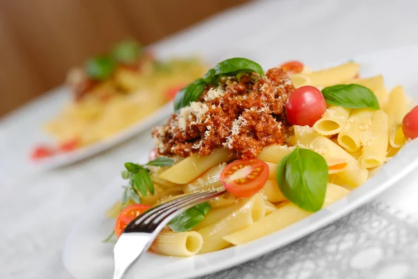 Pasta rigatoni on the white plate — Stock Photo © e_mikh #8867009