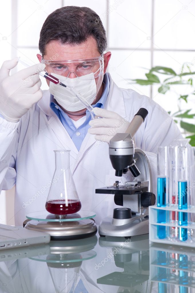 Doctor at laboratory blood examination Stock Photo by ©marcomayer 6516842