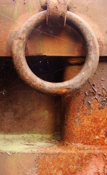 Detail view of an industrial rusty ring with cobweb - Stock Image ...