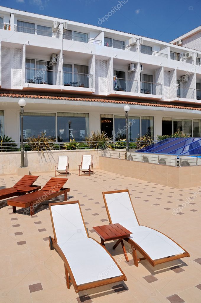 Beach chair with luxury resort – Stock Editorial Photo © sevaljevic ...