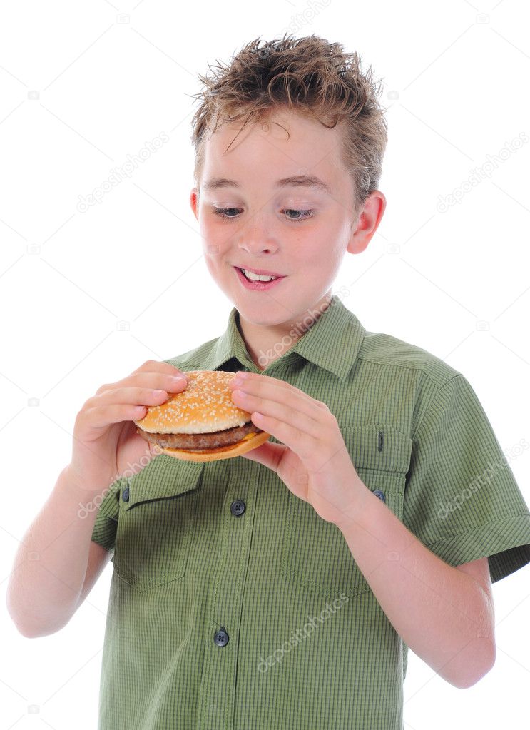 Little boy eating a hamburger Stock Photo by ©Lebval 5984195