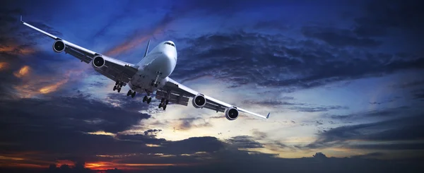 Jet plane in a sunset sky — Stock Photo © vladmoses #8647351