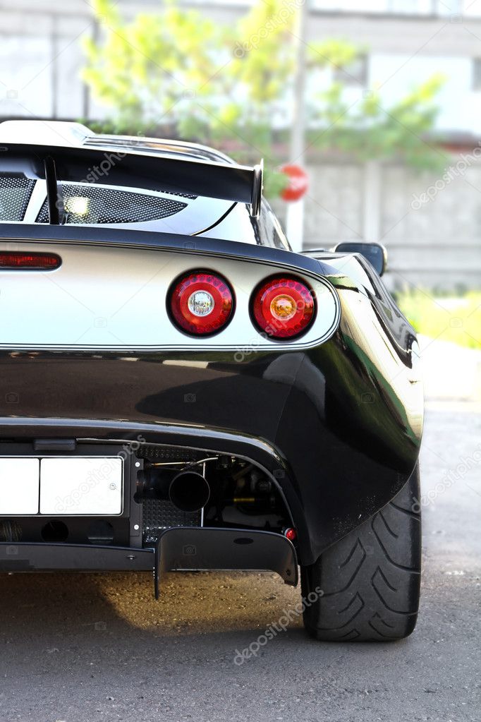 Back part of black sport car on nature background — Stock Photo ...