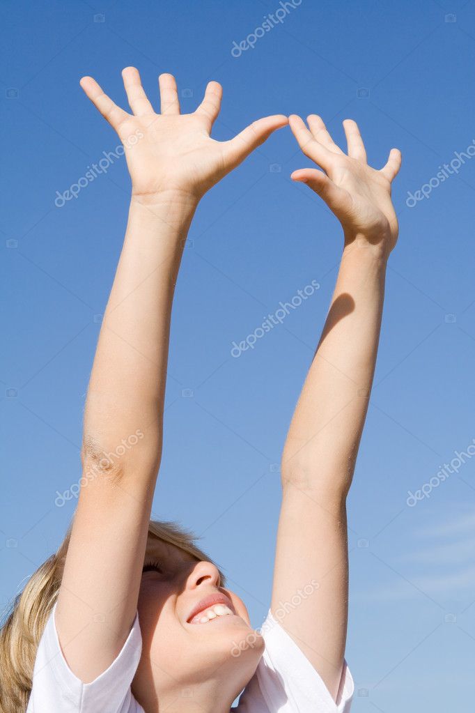 Determination, child with arms raised in the air reaching out — Stock ...