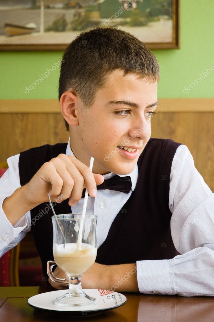 A teenager boy enjoying coffee in a cafe — Stock Photo © Be_Fly #6679161