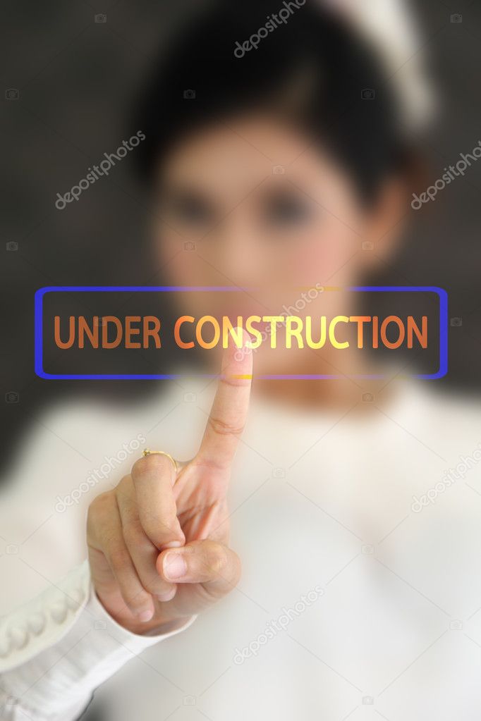 Woman hand pressing under construction button on a touch screen — Stock ...