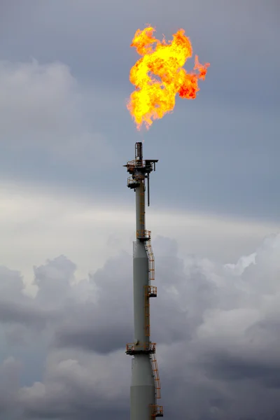 Flare burning gas at refinery plant - Stock Image - Everypixel