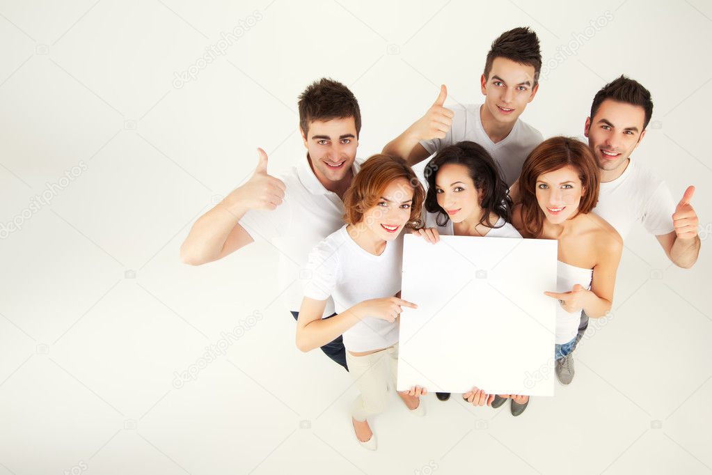 Friends holding blank banner — Stock Photo © shotsstudio #5939786