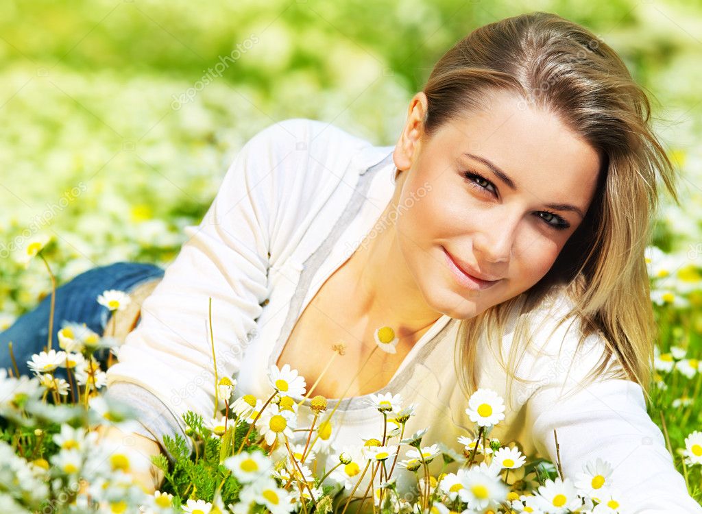 Beautiful female laying on the flower filed — Stock Photo © Anna_Om ...