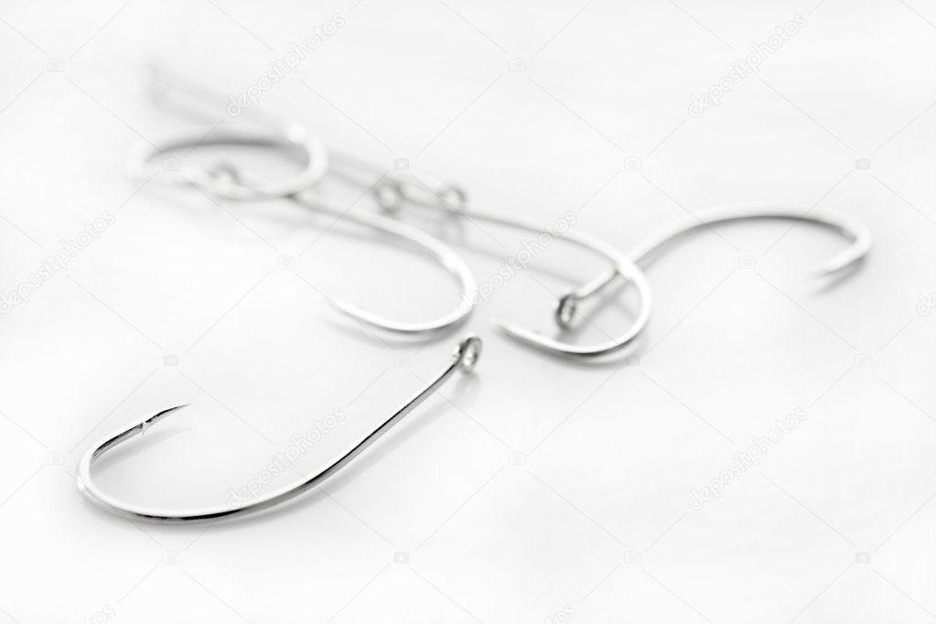 Fishing hooks over white background — Stock Photo © lunamarina #5503111