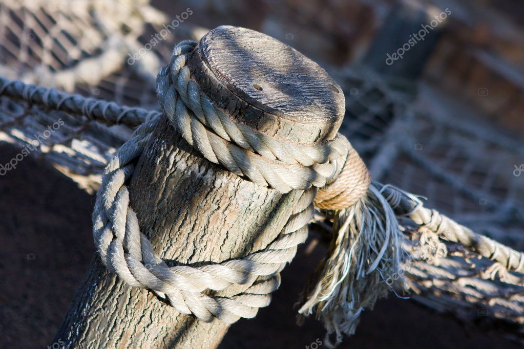 Close-up of rope wrapped around a wooden stake — Stock Photo ...