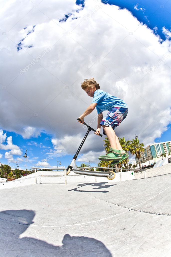 Boy with scooter is going airborne — Stock Photo © Hackman #5657164