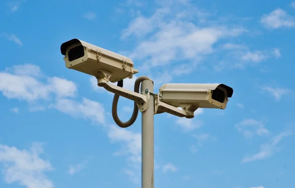 Surveillance Security Camera or CCTV with traffic light — Stock Photo ...