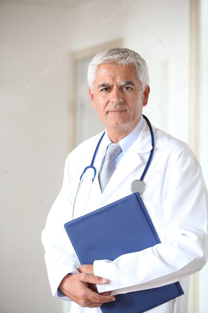 Doctor standing in hall Stock Photo by ©Goodluz 6701402