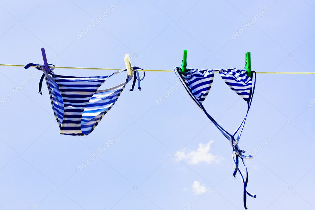 Drying woman swimsuit Stock Photo by ©vvoennyy 6206783