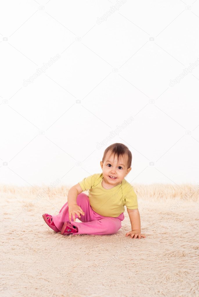 Little kid on the carpet Stock Photo by ©aletia 5763604