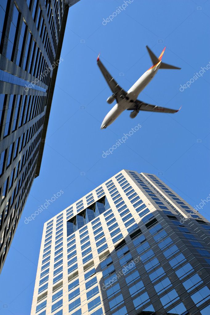 Beijing: plane over modern buildings Stock Photo by ©mamahoohooba 5734484