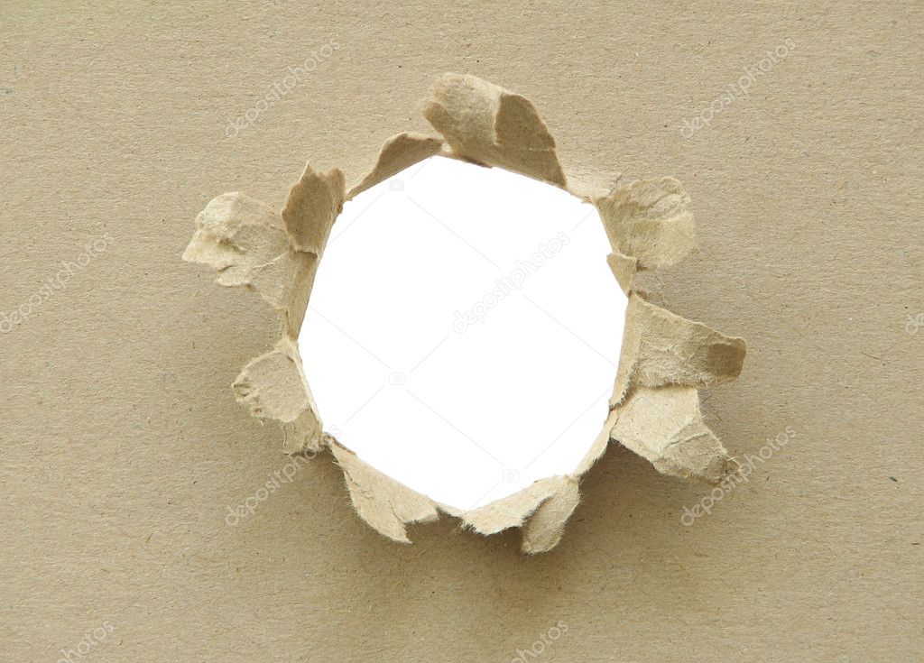 Hole in the cardboard. Stock Photo by ©jurisam 5794178