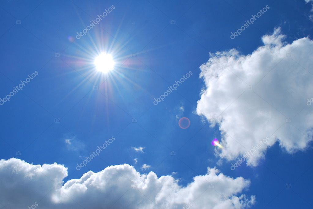 Bright sun with blue skies and clouds — Stock Photo © gnohz #5840571