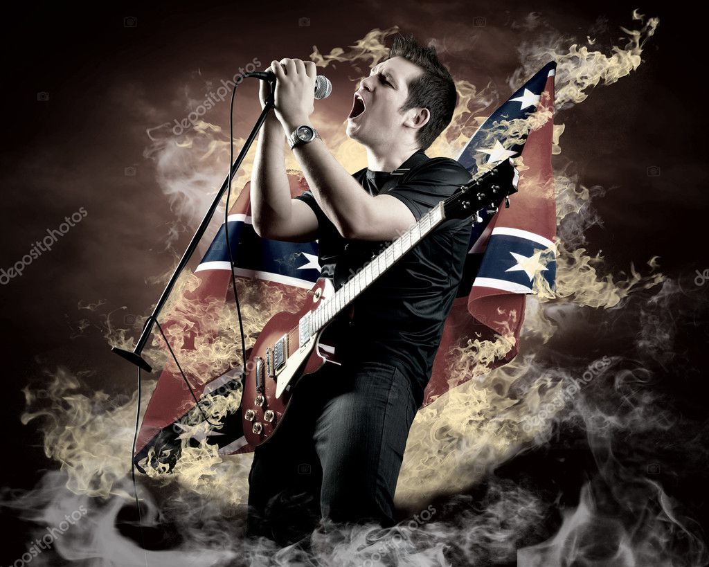 Rock guitarist play on the electric guitar around fire flames Stock ...