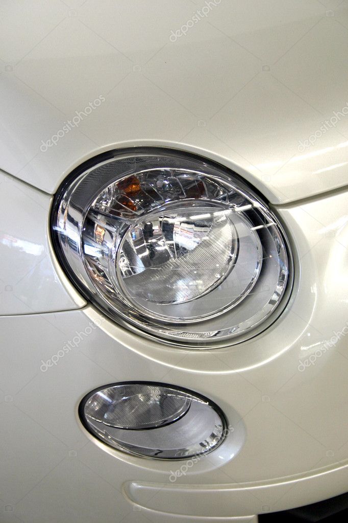 Round headlight of the new car — Stock Photo © ArchManStocker #6268910