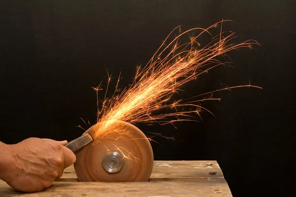 Senior craftsman hand grinding - Stock Image - Everypixel