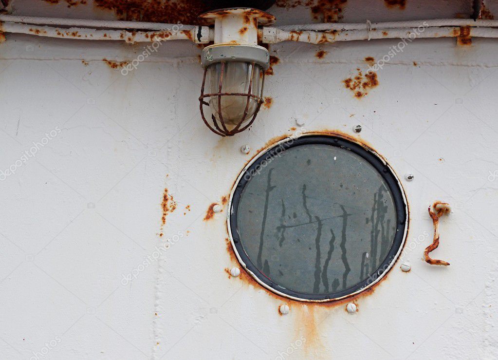 Port hole and light on a rusty old ship — Stock Photo © mcornelius #6607438