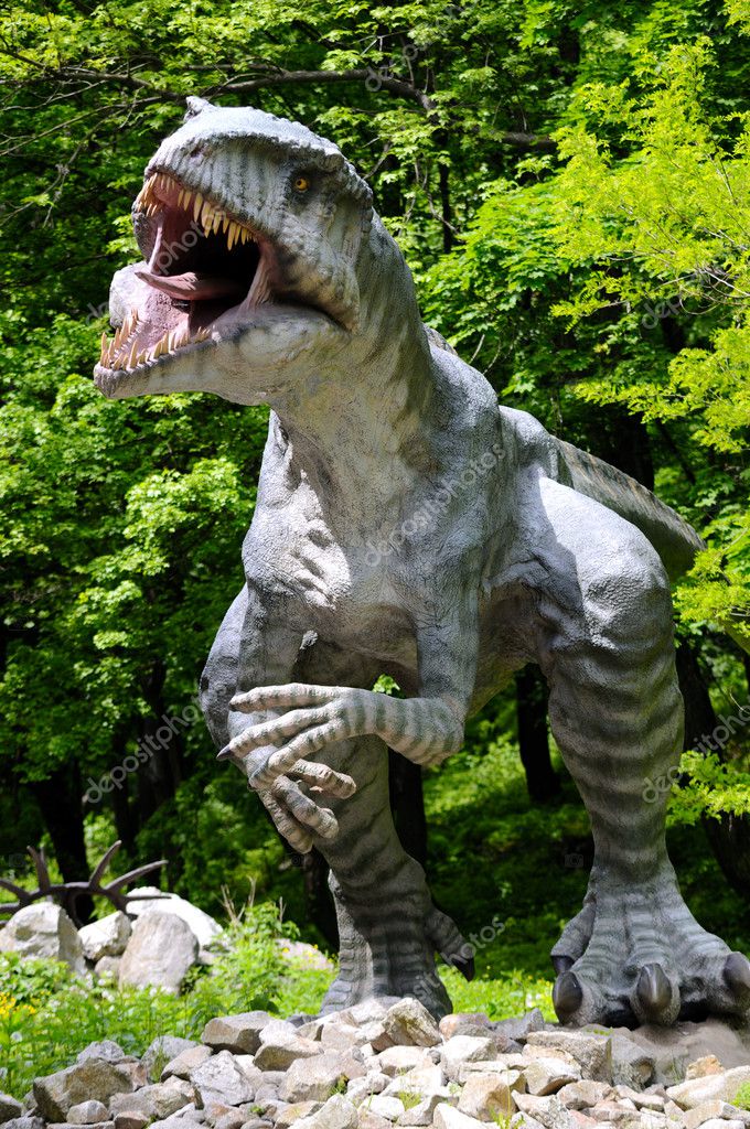 Dinosaur with an open muzzle and sharp teeth — Stock Photo ...